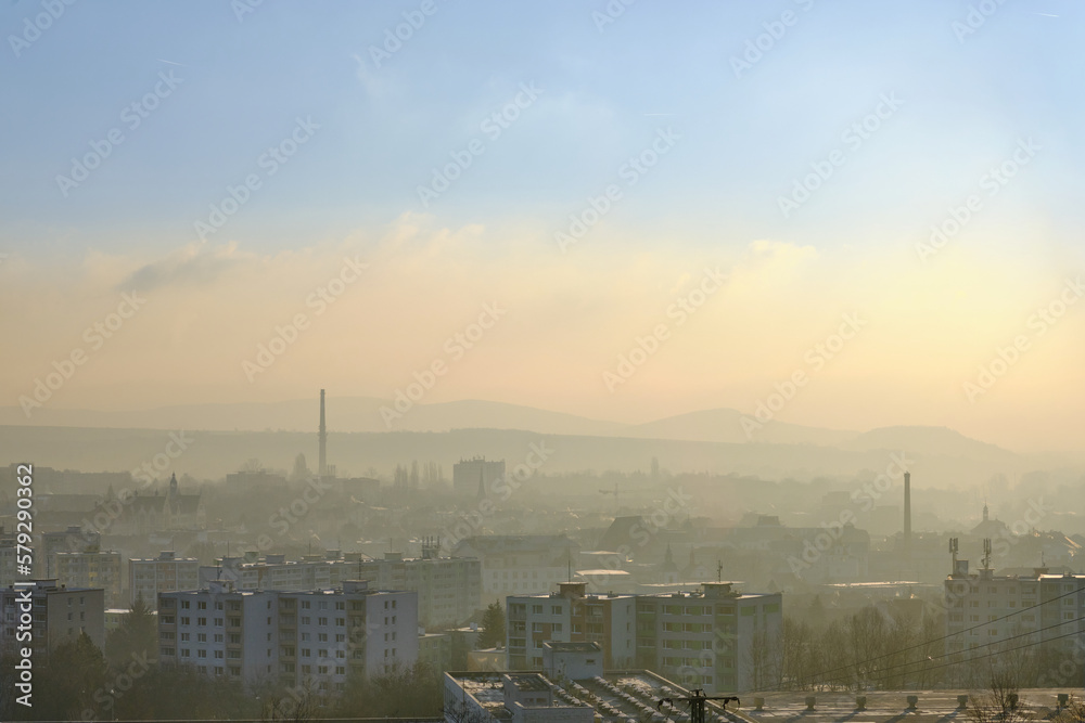 Smog air pollution over a small historic industrial town with mountains ...