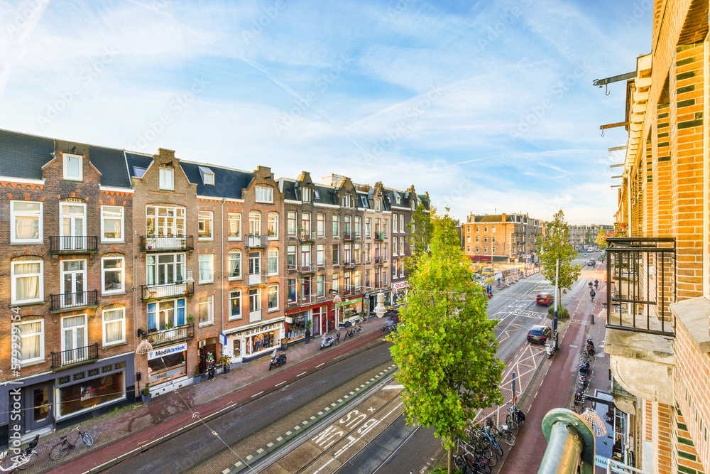 Amsterdam, Netherlands - 10 April, 2021: a city street with buildings ...