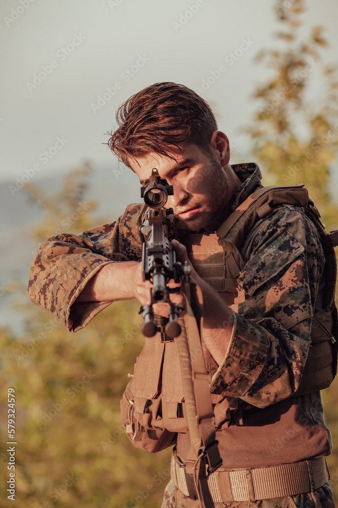 A modern warfare soldier on war duty in dense and dangerous forest ...