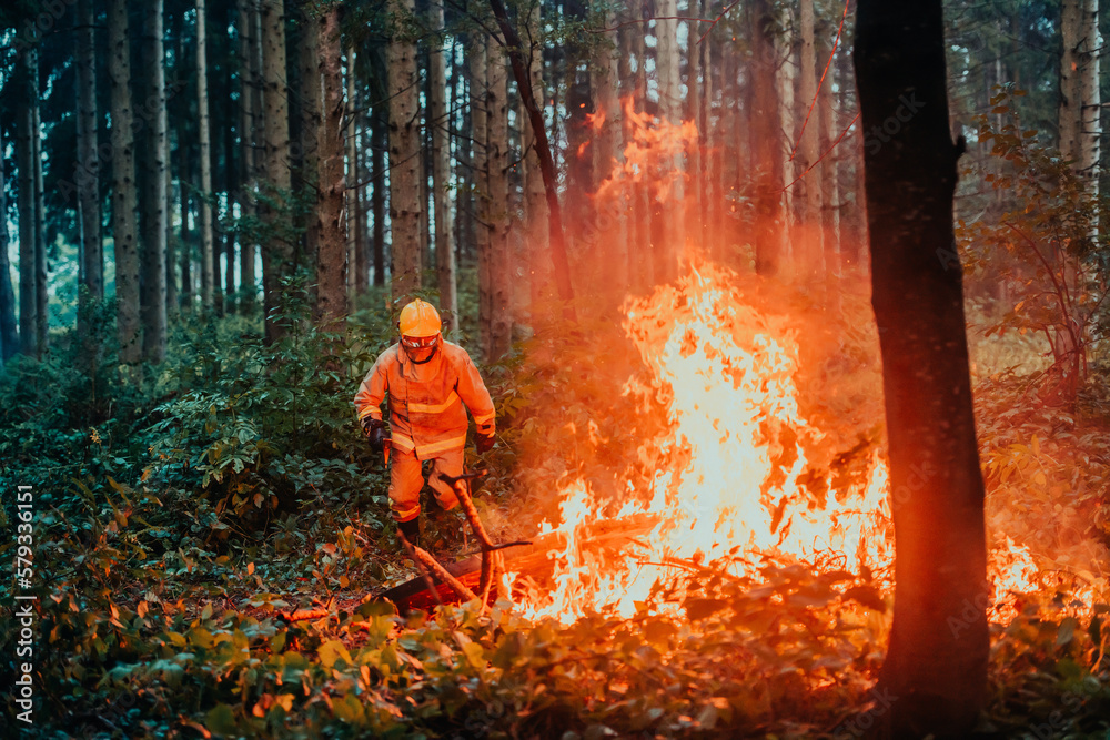 firefighter hero in action danger jumping over fire flame to rescue and ...