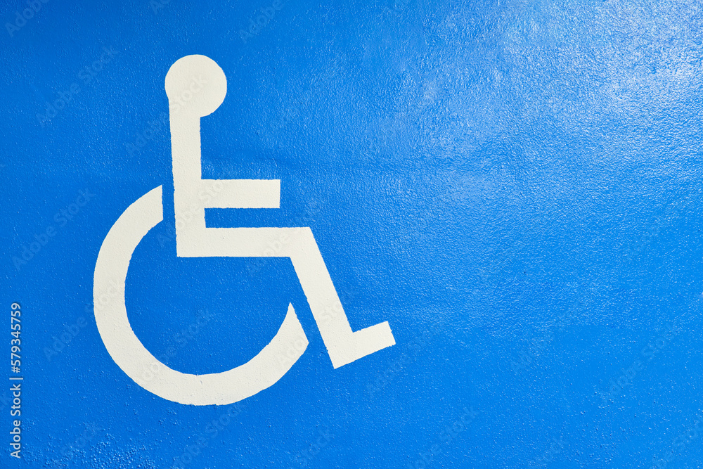 wheelchair symbol in white on a blue background for garage spaces ...