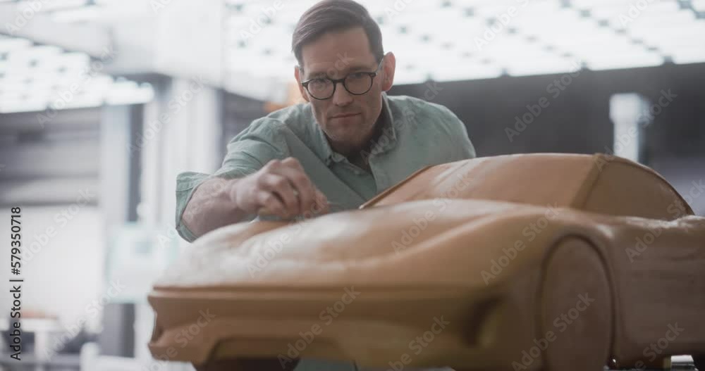 Portrait of an Automotive Designer Sculpting a 3D Clay Model of a New ...