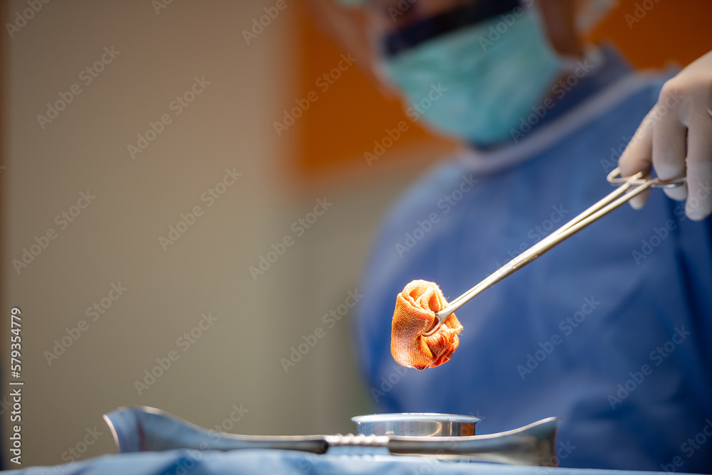Hand of surgery doctor in Operating Room hold operating plier forceps ...
