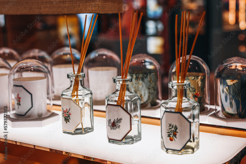 Aroma diffuser wooden sticks in the glass transparent bottle. Cozy home ...