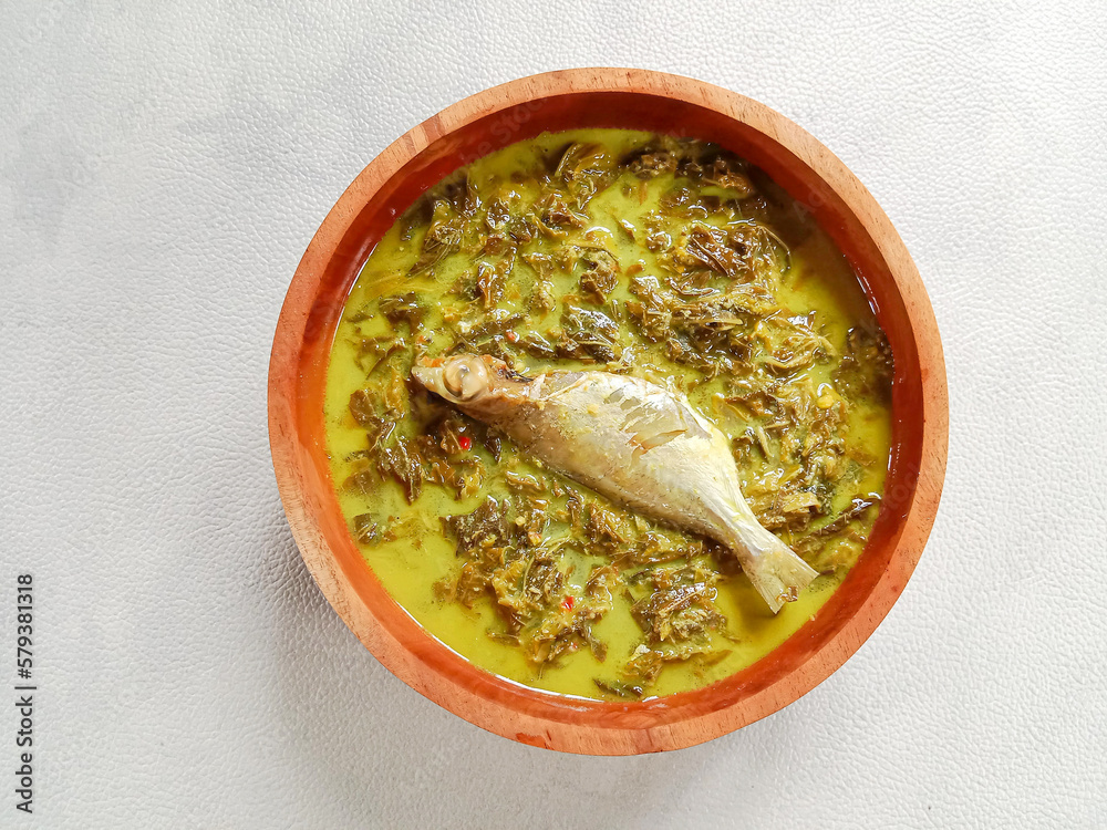 Cassava leaves curry with salted fish. Indonesian traditional dish made ...