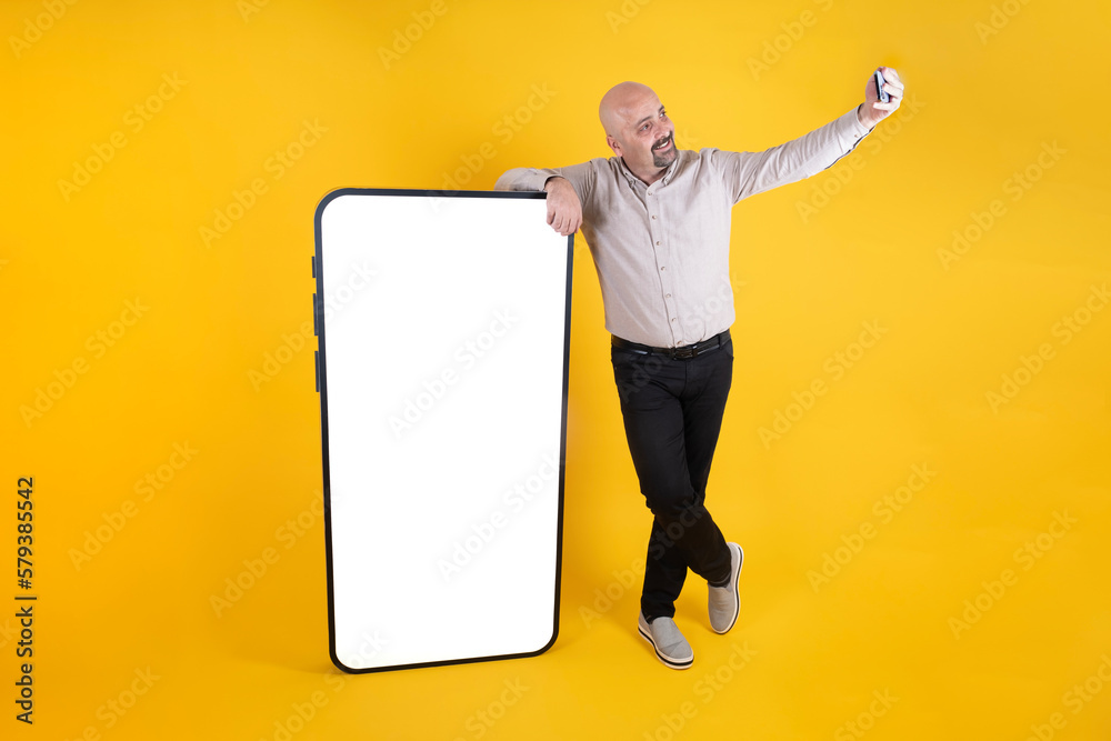 Big huge mobile phone, life size full body length of caucasian male ...