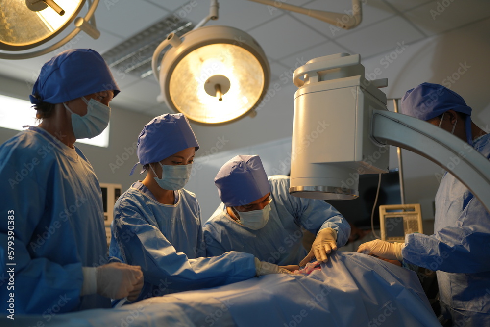 Medical Team Performing Surgical Operation in Modern Operating Room ...