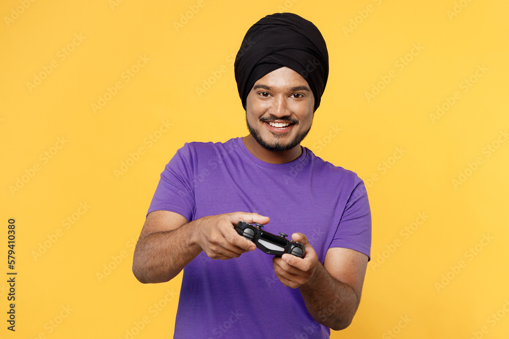 Fun devotee Sikh Indian man ties his traditional turban dastar wear ...