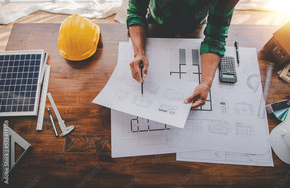 Male engineer drawing architectural plans Engineer sketching ...