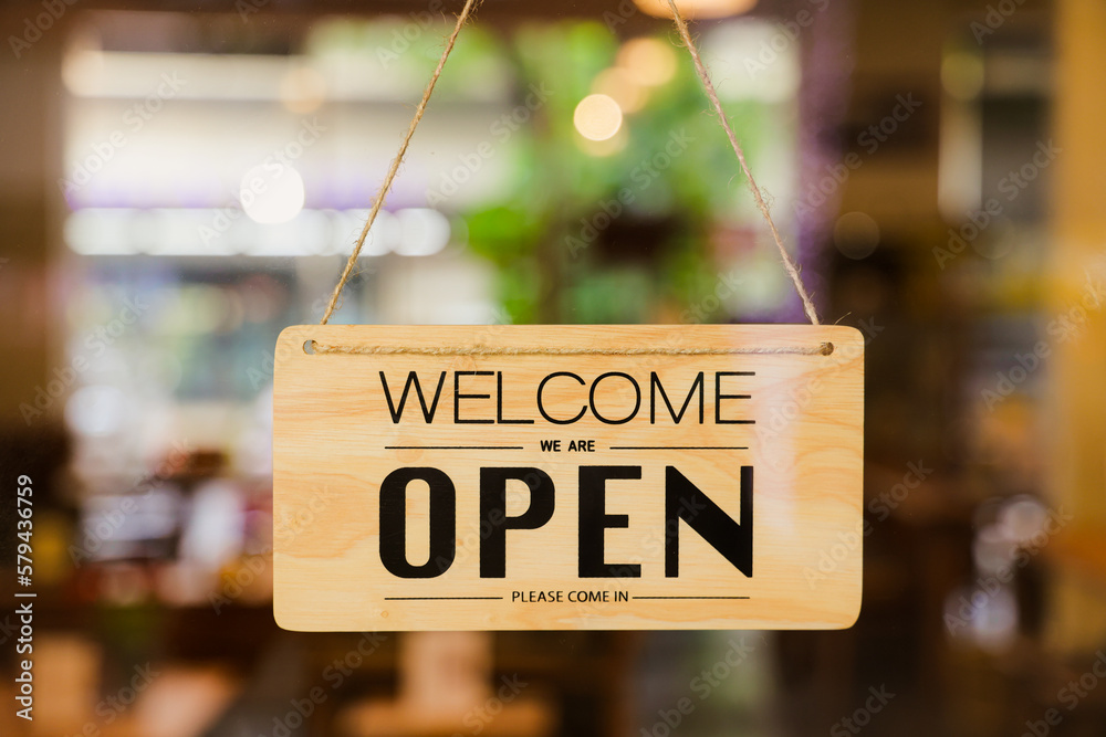 Welcome We Are Open Please Come in on shop hang on door at entrance ...