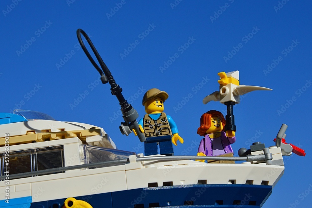LEGO city figure of boy with fishing pole and his mother with seagull ...