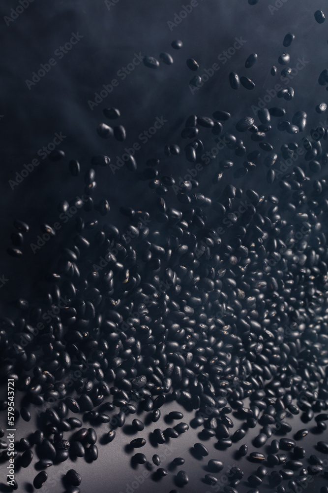 Black Bean flying explosion, black grain beans explode abstract cloud ...