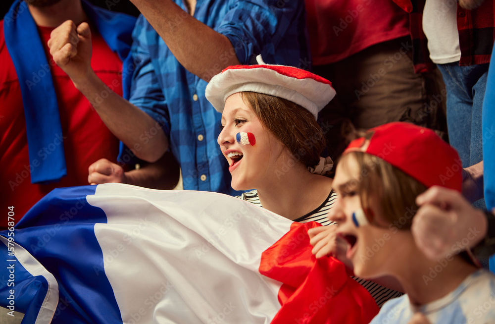 Football, soccer fans, men and women with countries flags emotionally ...