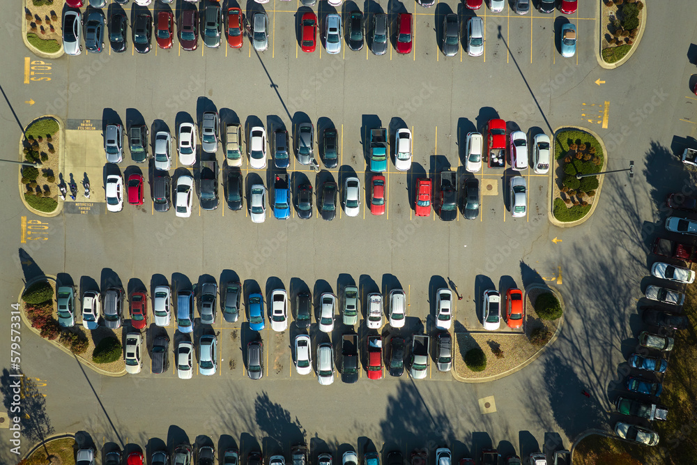 View from above of many parked cars on parking lot with lines and ...