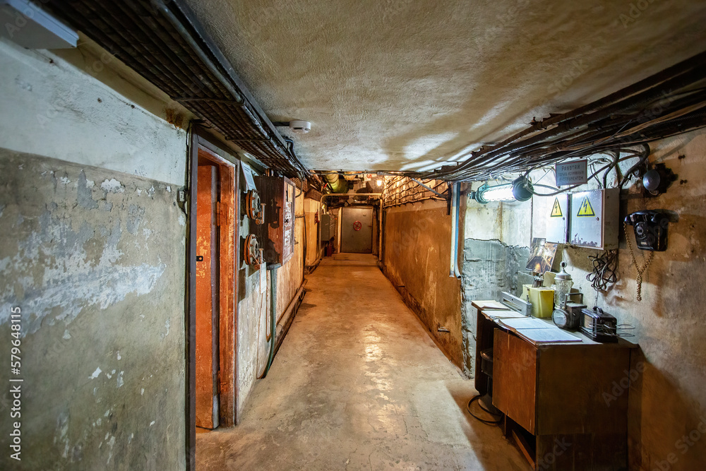 Abstract dark corridor of military bunker interior, grungy old ...