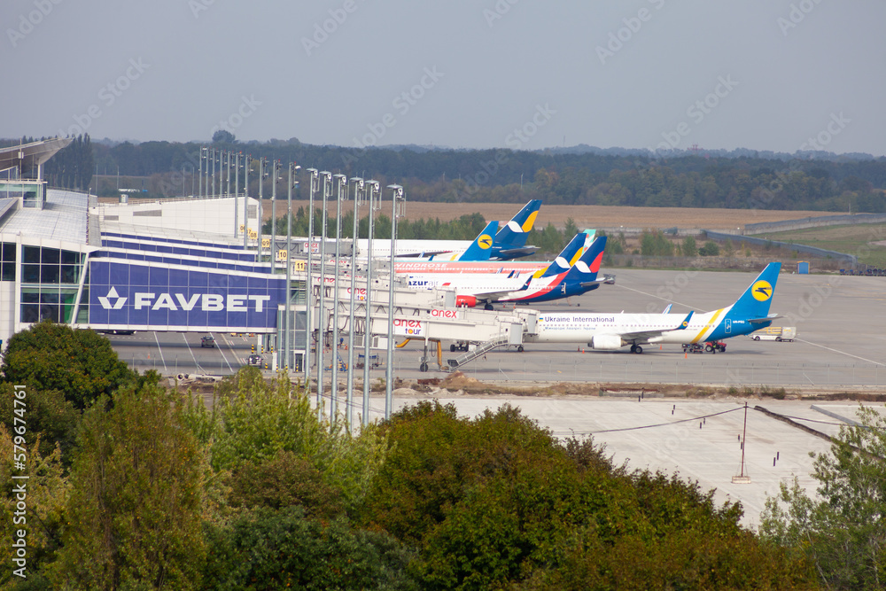 Ukraine, Kyiv - October 10, 2020: Airplanes are parked at Terminal D of ...