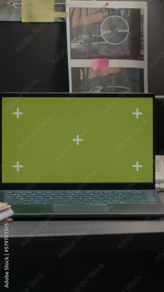 Vertical video: Greenscreen display on portable laptop in incident room ...