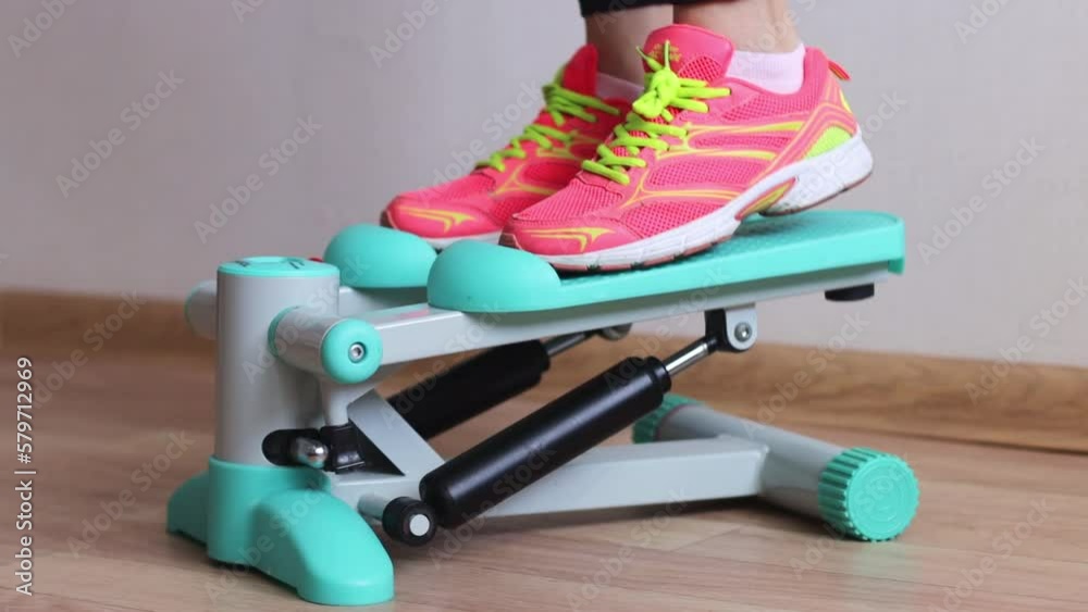 Vídeo do Stock: Exercises, cardio training with stepper at home. Woman ...
