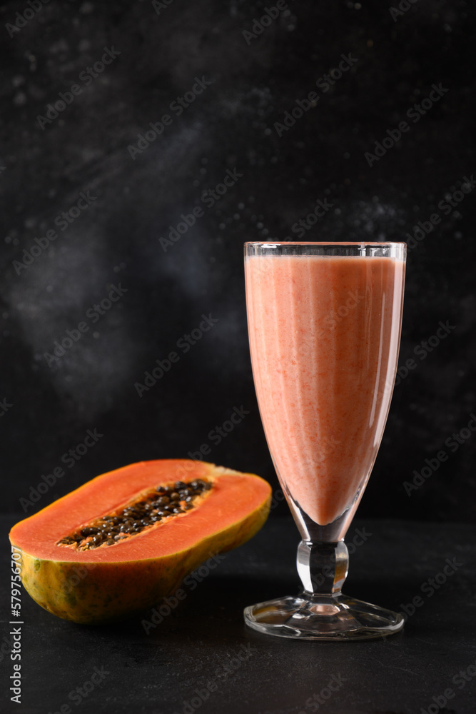 One glass of Papaya lassi on black background. Freshness cold beverage ...