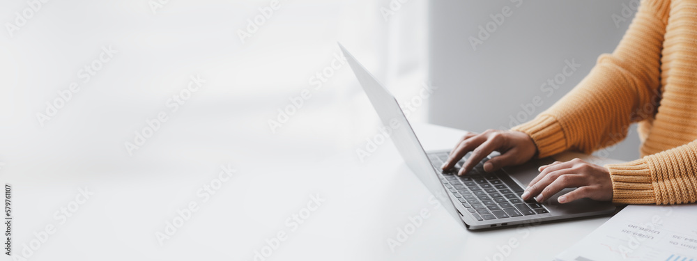 Person typing on laptop keyboard, businessman working on laptop, he is ...