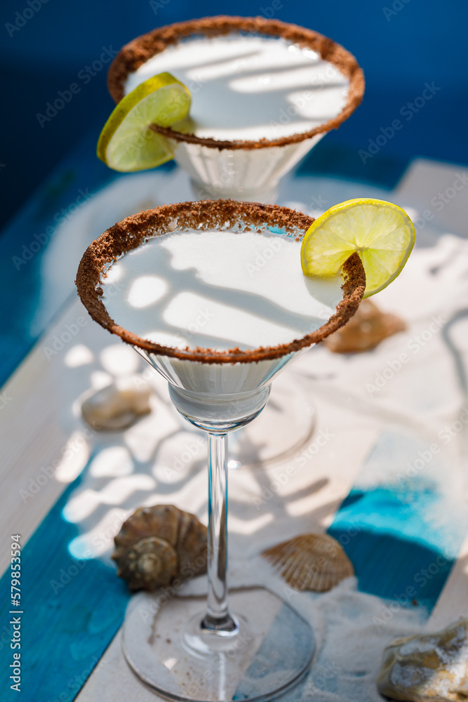 Key lime pie cocktail in martini glass. Martini alcoholic cocktail or ...