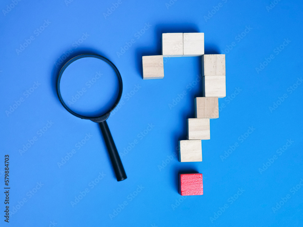 Poster Wooden cubes arrange as question mark symbol with magnifying ...