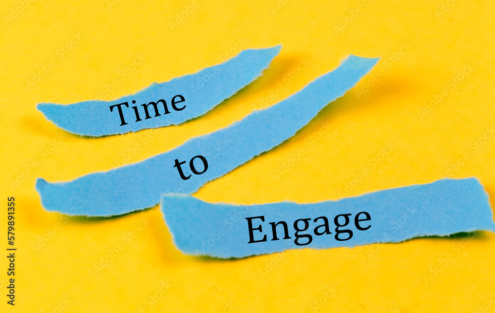 TIME TO ENGAGE text on a blue pieces of paper on yellow background ...
