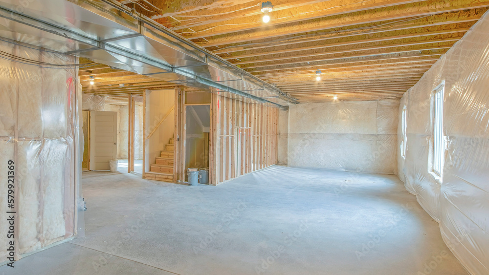 Panorama Large unfinished basement with woodframes and wall insulation ...