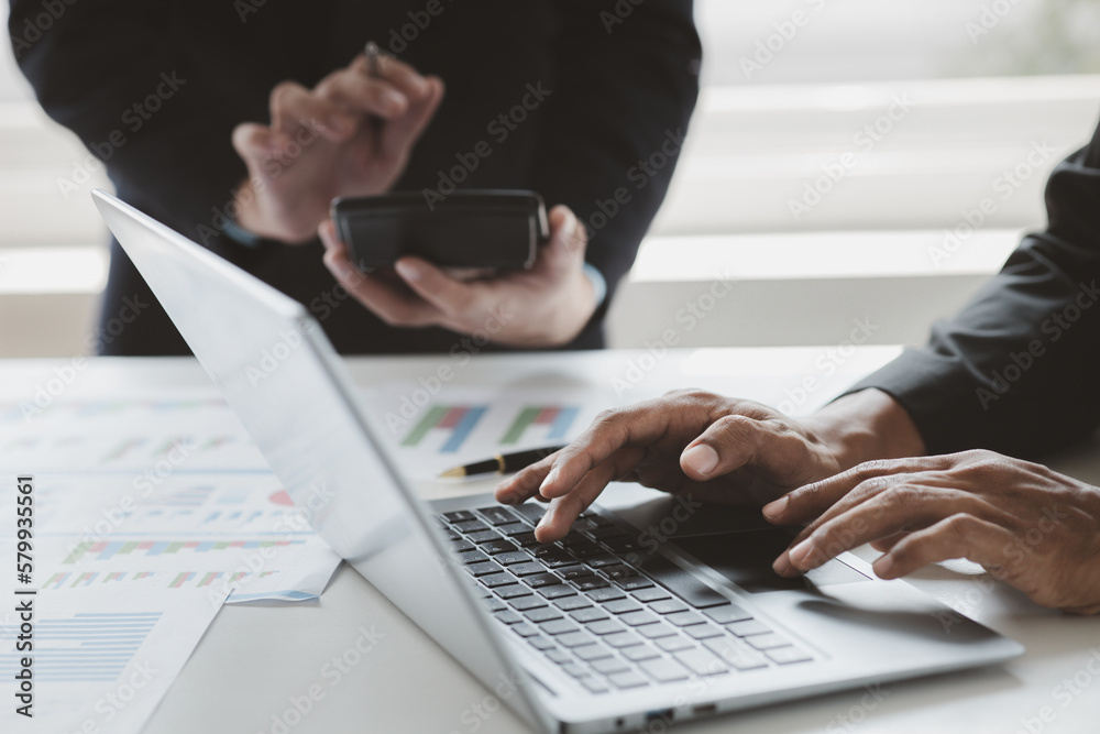 Person typing on laptop keyboard, businessman working on laptop, he is ...
