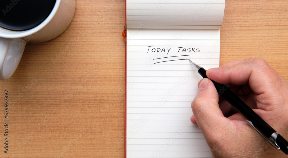Today Tasks text hand written with a pencil on a notepad to encourage ...