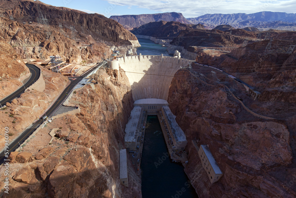 Hoover Dam is a massive, concrete arch-gravity dam, 660 feet thick at ...