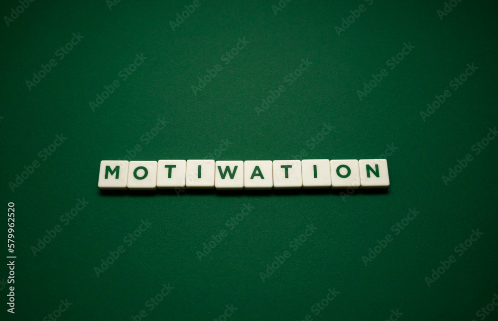 the word motivation laid out from letters.motivation letter on a green ...