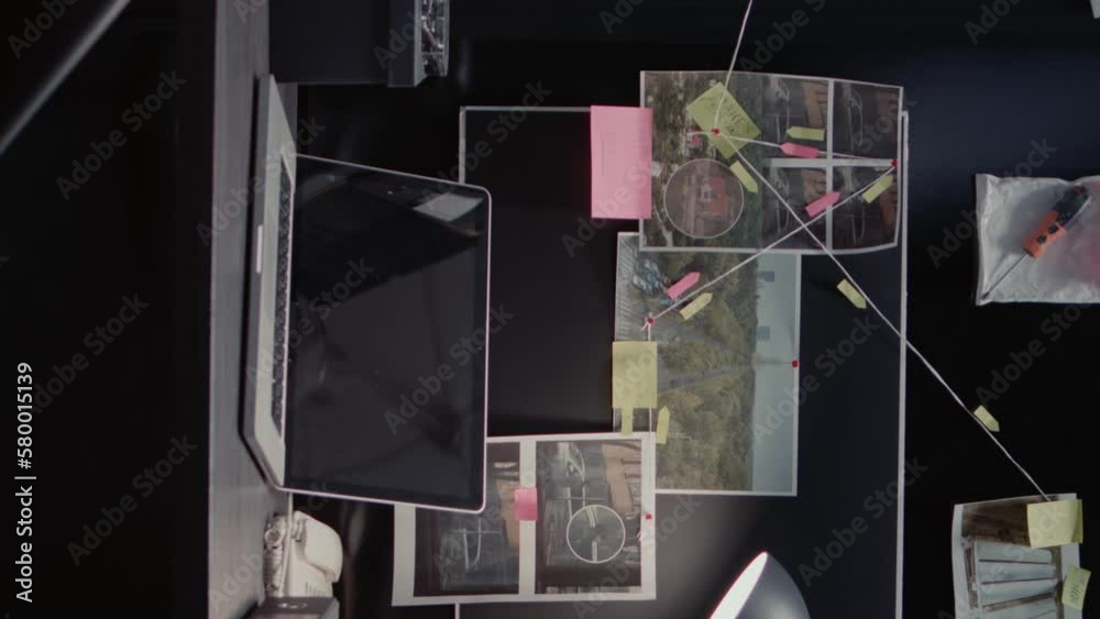 Vertical video: Criminal evidence board in private investigation office ...