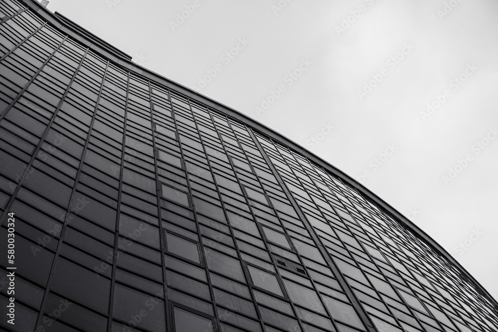 Black and white monochrome high-rise building with glass facade ...