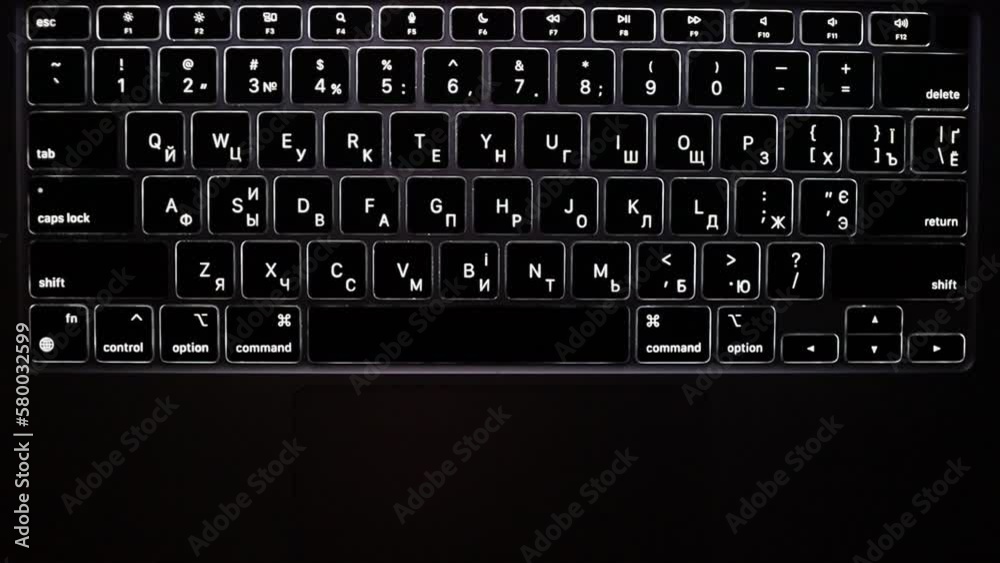 Vidéo Stock Close up laptop keyboard backlight, backlit keyboard, top ...