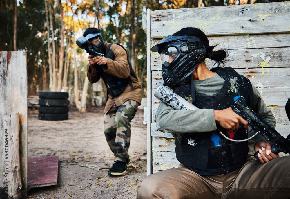 Sports, paintball and woman with gun for battle, game or competition ...