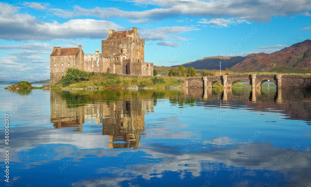 Eilean Donan castle in a golden hour light of early morning. Medieval ...