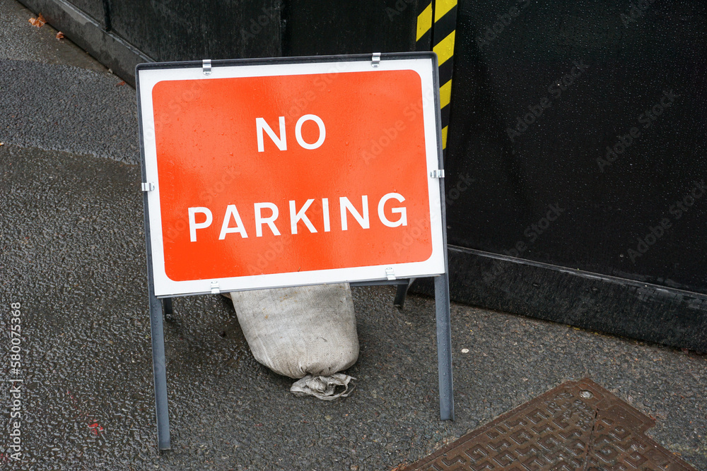 Foto De No Parking Road Sign On Side Of Street Restriction Sign On Foto De No Parking Road Sign On Side Of Street Restriction Sign On