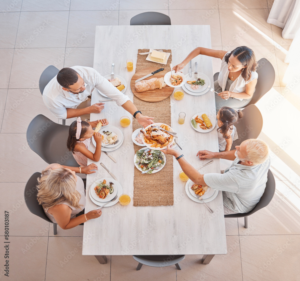 Foto de Family, lunch and food at the table with big family bonding ...