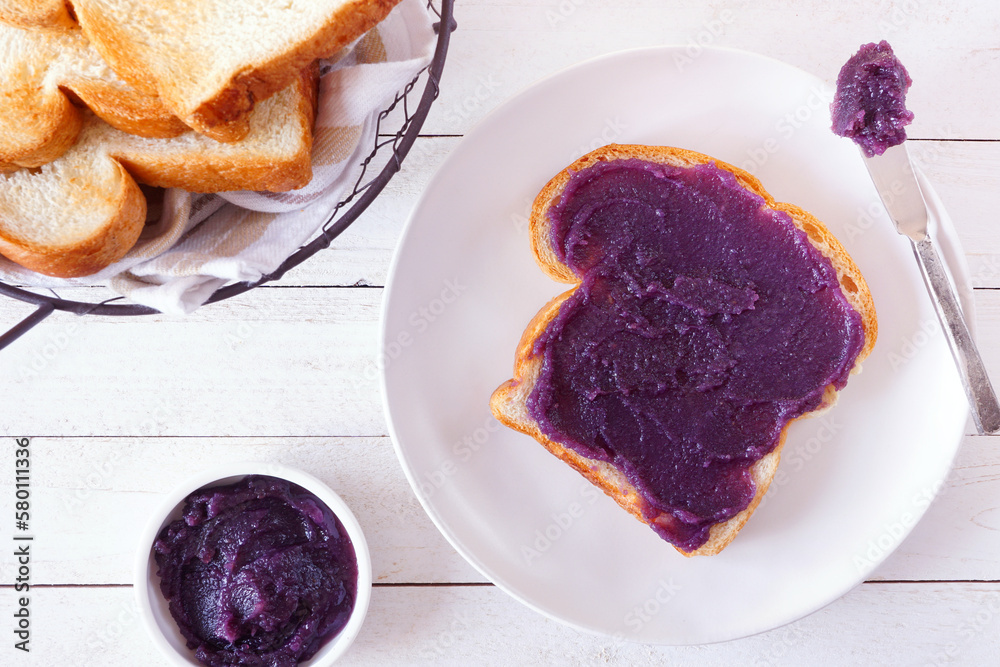 Toast with ube halaya jam. Sweet, trendy, purple yam spread. Overhead ...