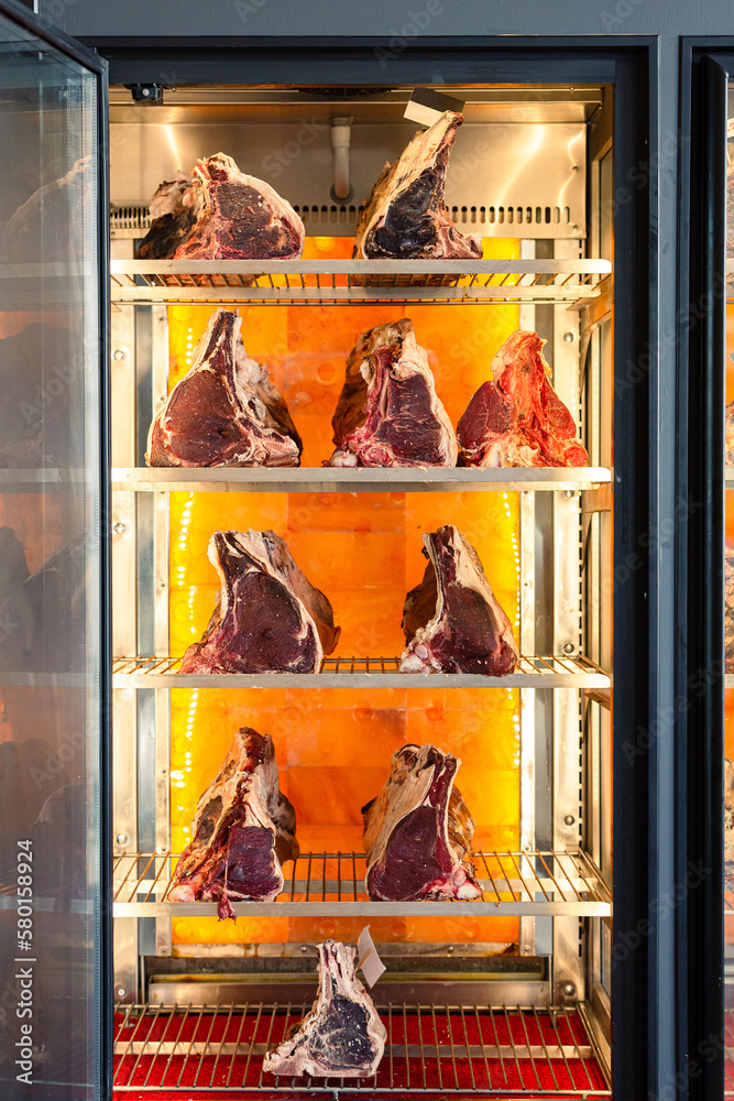 Meat department, showcase with variety of meat in different cuts ...