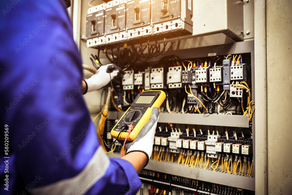 Electricity or electrical maintenance service, Electrician hand holding ...