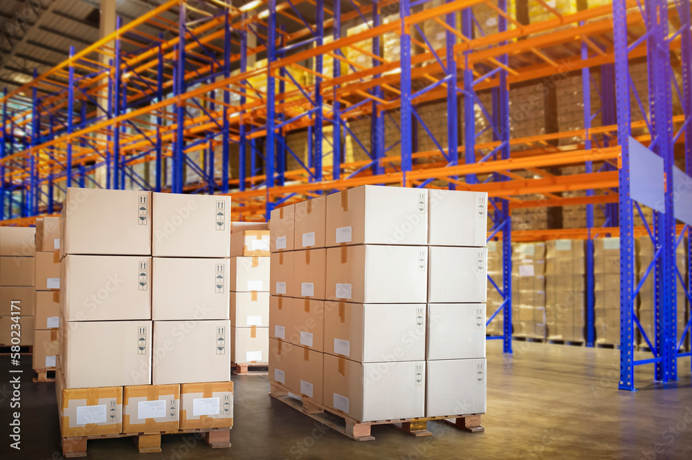 Package Boxes Stacked on Pallets in Storage Warehouse. Cartons ...
