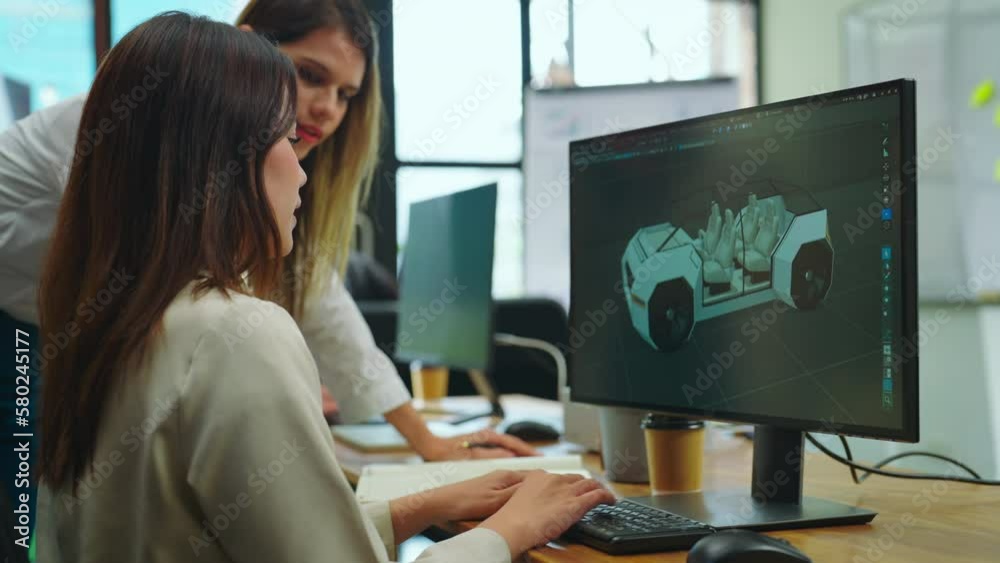 Female designer using computer to design ev car prototype at office ...