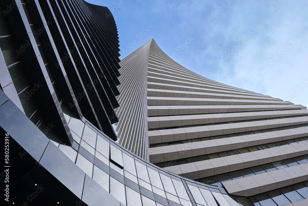 Bottom view of the black tower of skyscrapers Axis Towers Art Nouveau ...