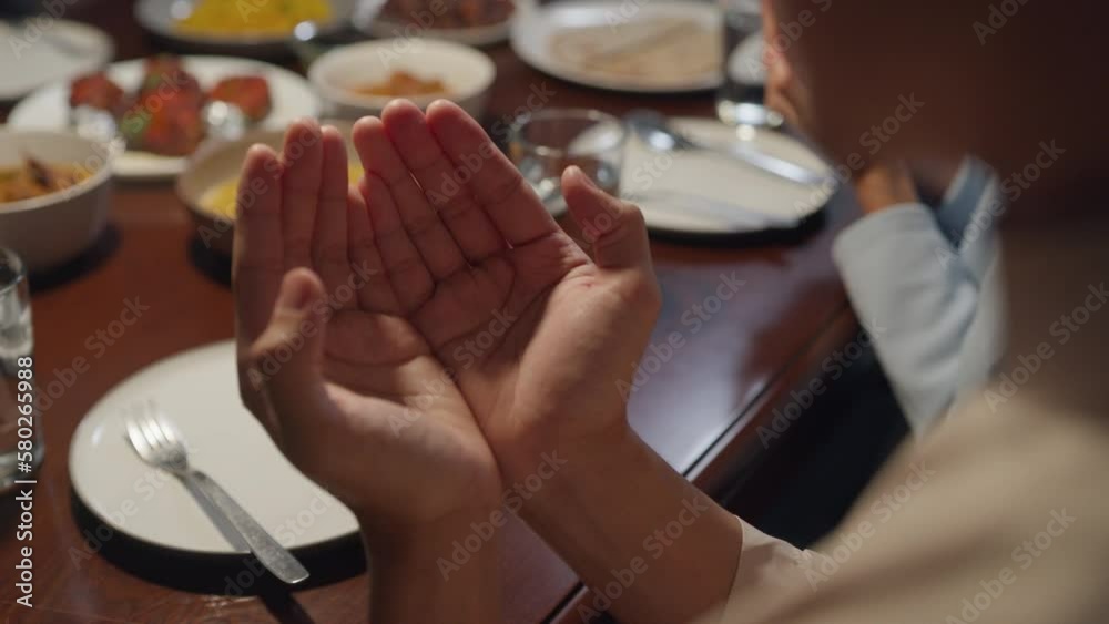 Close-up islam woman hand pray. Happy Asian muslim family praying to ...