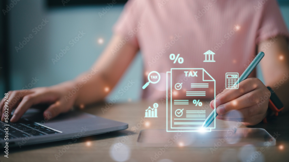 Foto de Corporate and individual tax payment concept, woman using ...