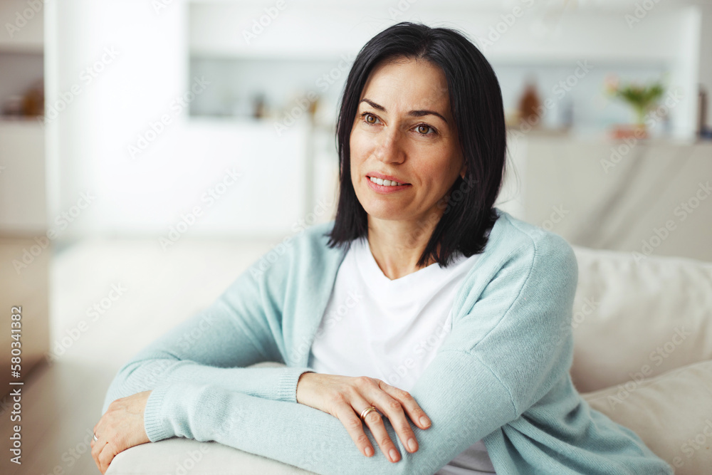 Pretty 50-years-old lady waiting for her grandchildren to visit her on ...