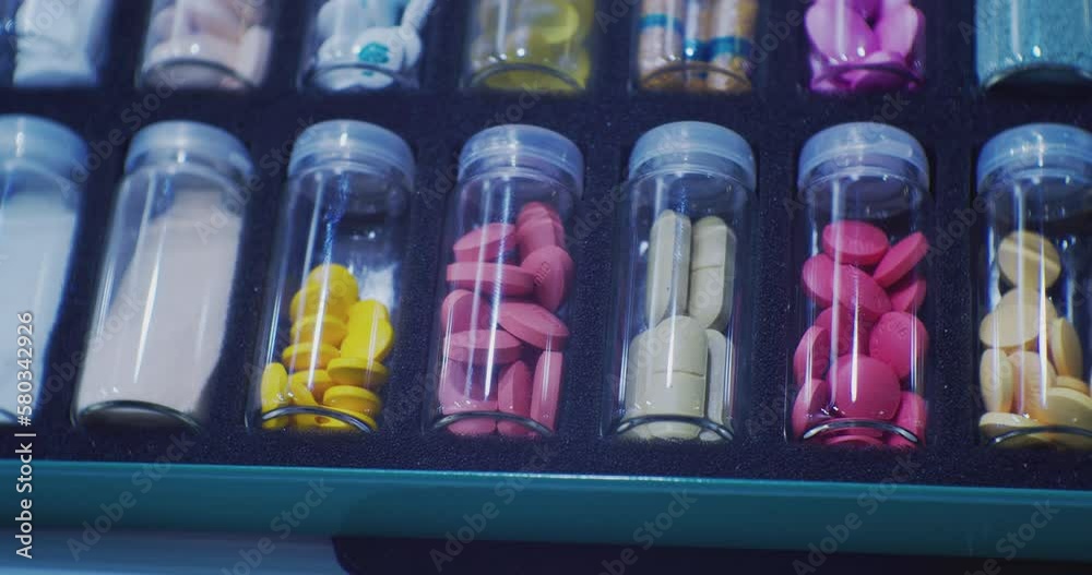 many different drugs of different shapes and colors packaged in ...