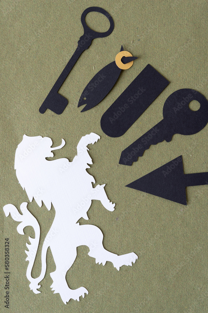heraldic lion silhouette and black paper shapes (keys, fish, arrow) on ...